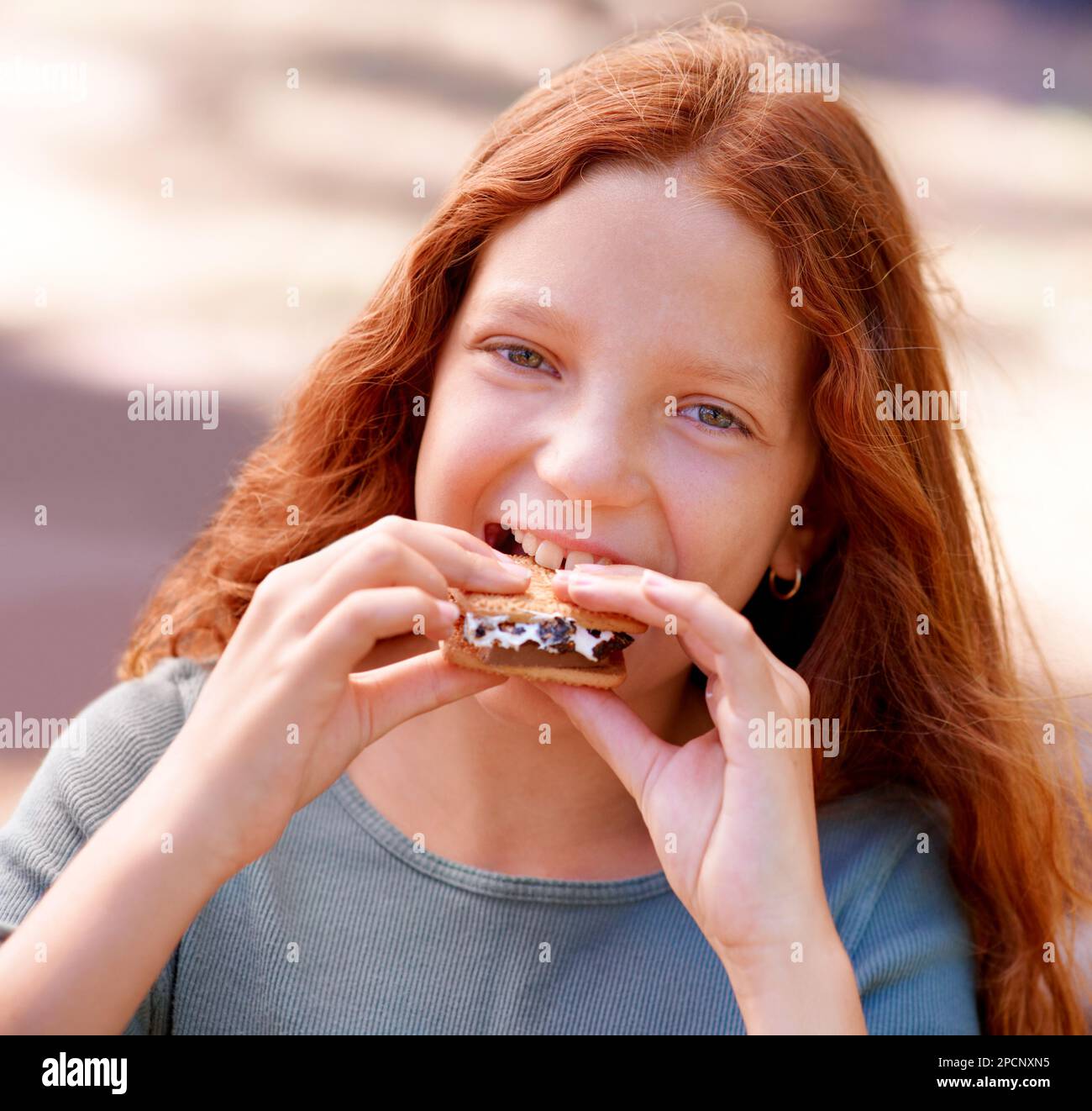 Mmm, its my favorite. Cute little girl eating a delicious smore Stock ...