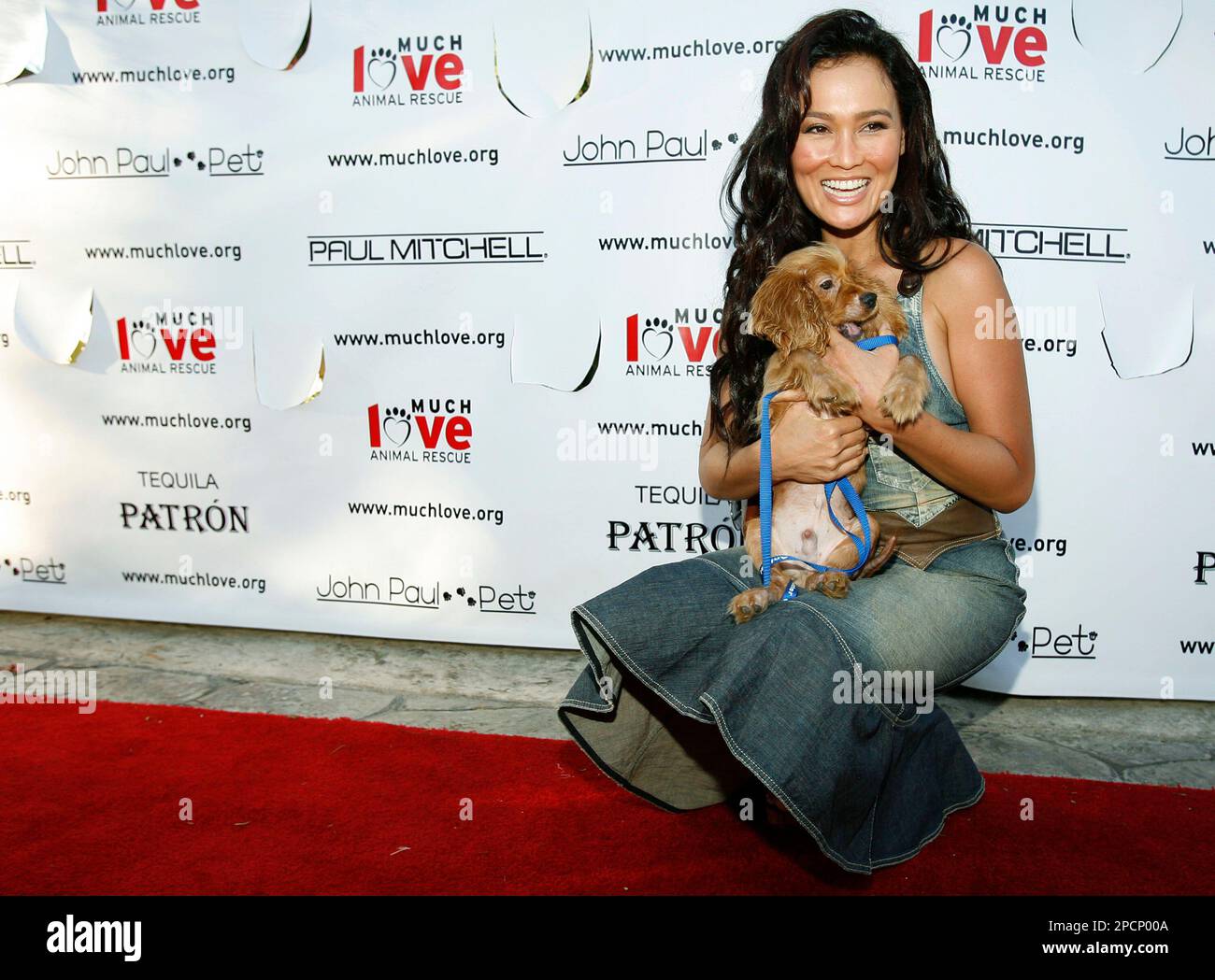 Actress Tia Carrere poses for photographers at the Much Love Animal ...