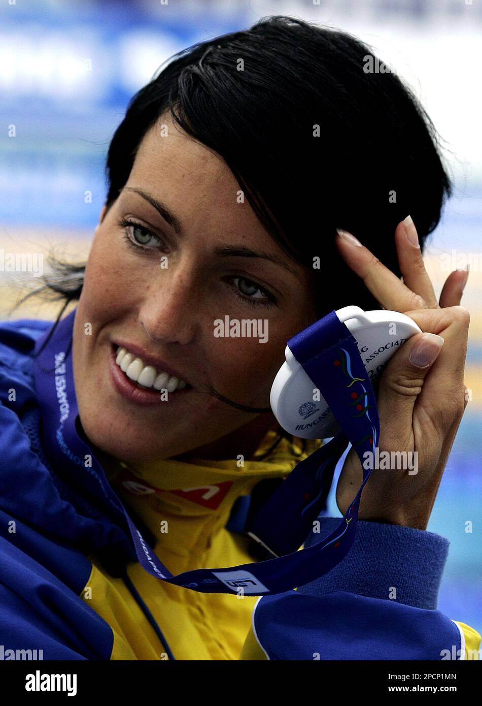 Therese Alshammar from Sweden holds the gold medal as she adjusts her ...