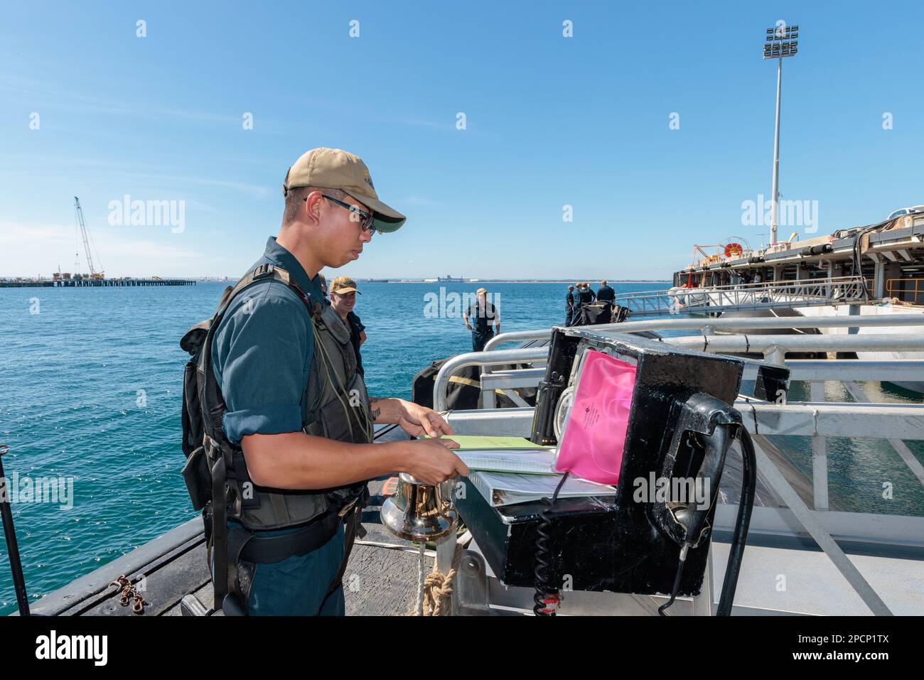 Crew members are seen working onboard the USS Asheville, a Los Angeles ...