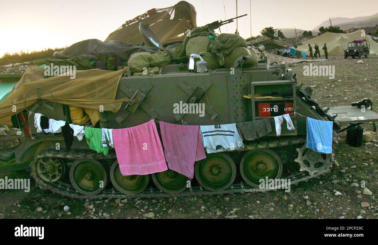 Laundry from Israeli soldiers hangs on the side of an armored vehicle ...