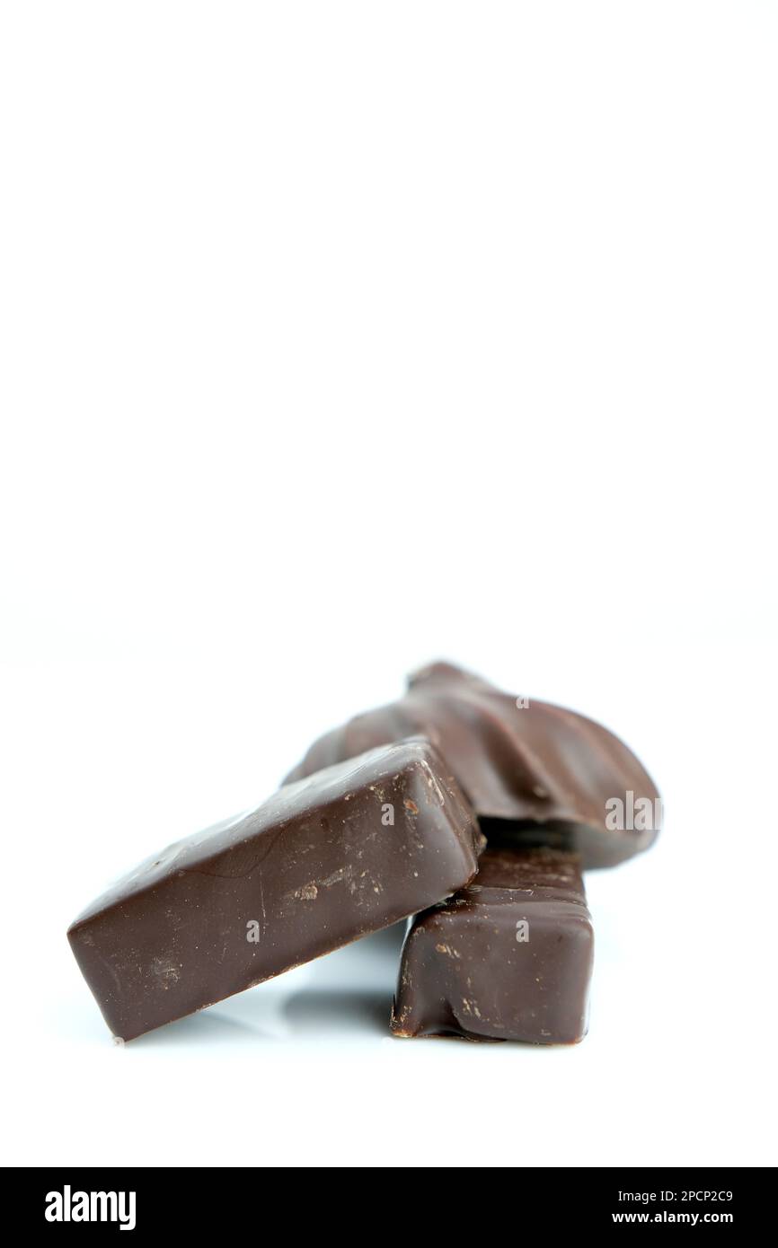 Three chocolate candies bird milk with soft filling. Delicious glazed ...