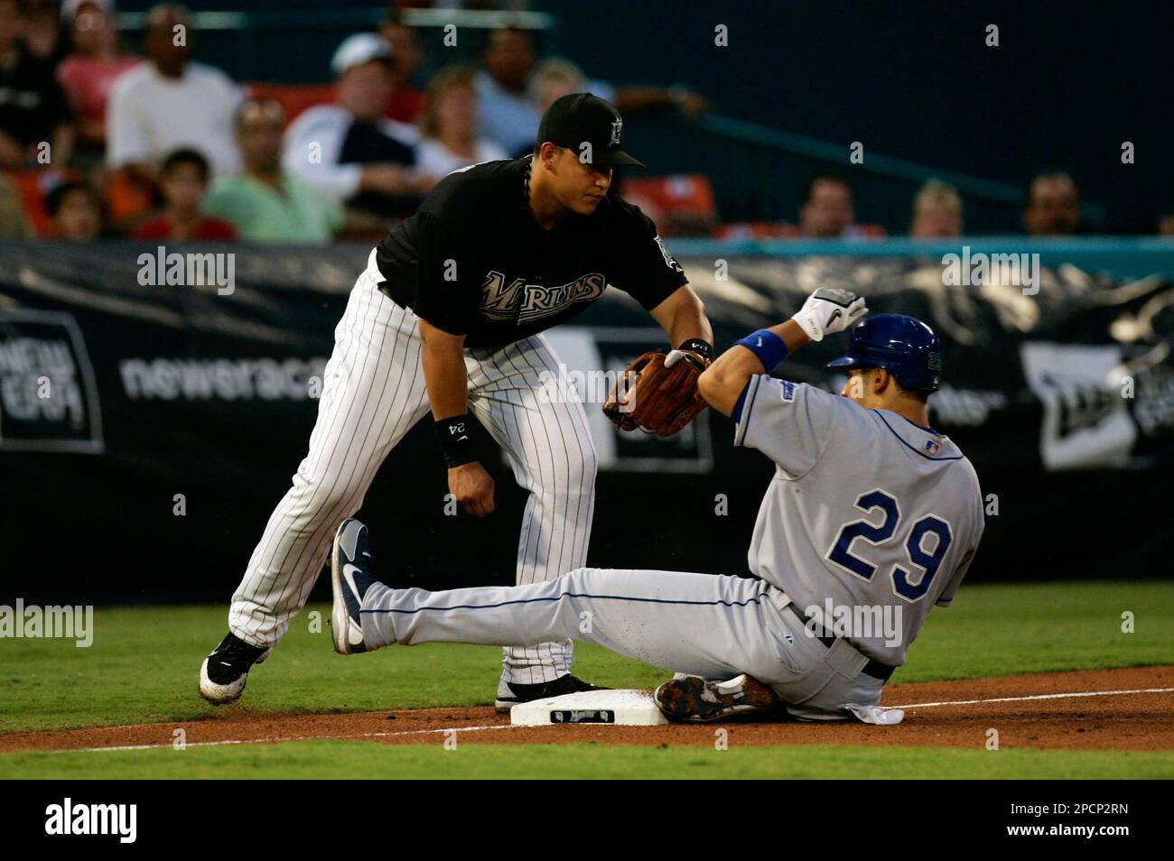 Los Angeles Dodgers runner James Loney (29) slides into third base on a ...