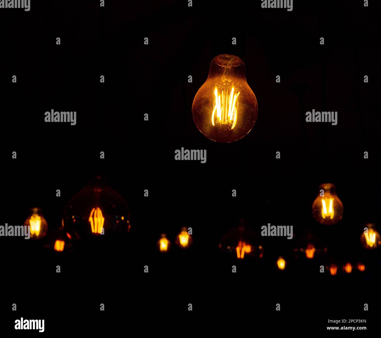 Vintage incandescent light bulb filament on black, close up shot Stock ...