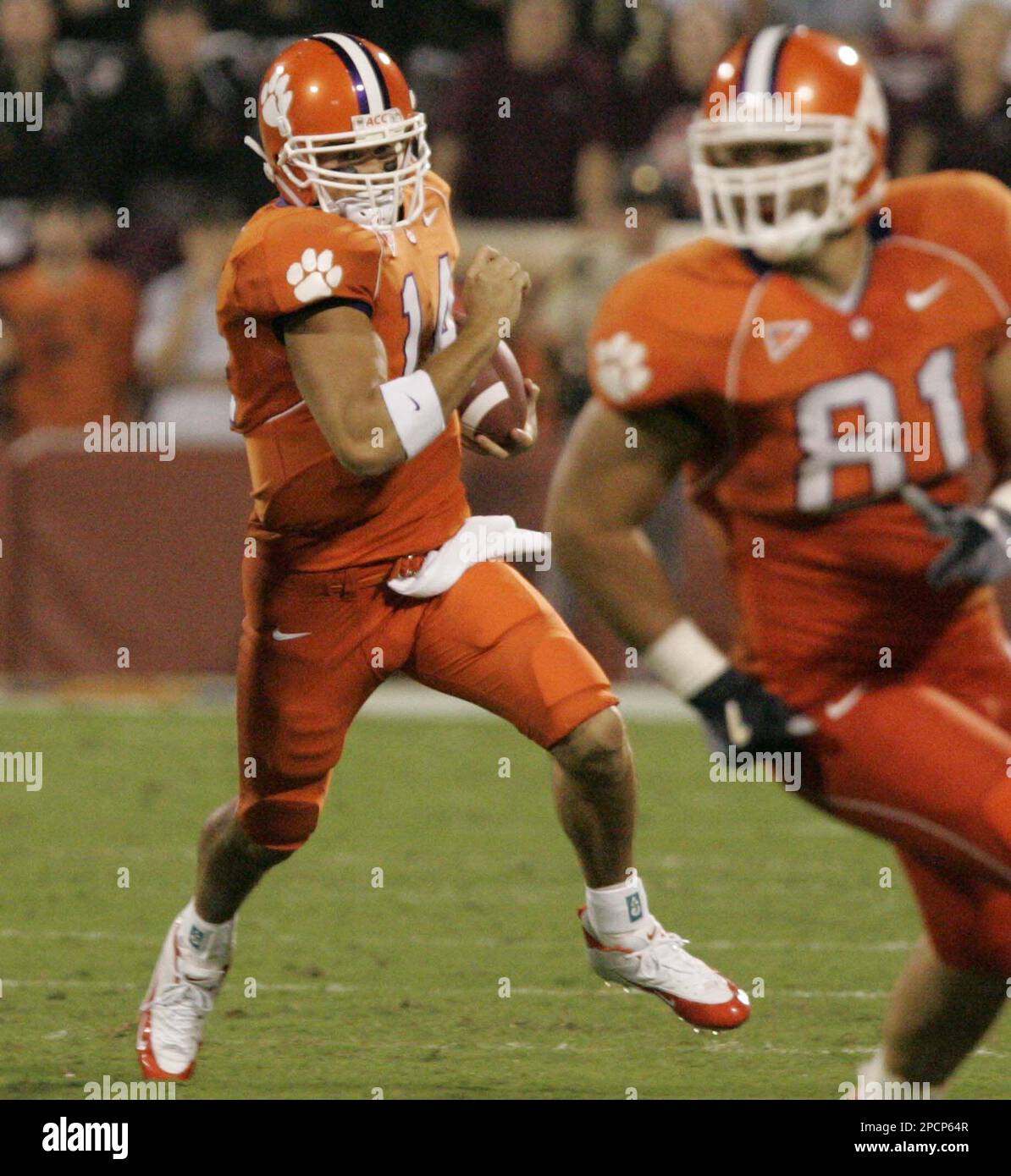 Clemson's Will Proctor runs with the football as Clemson's Bobby ...