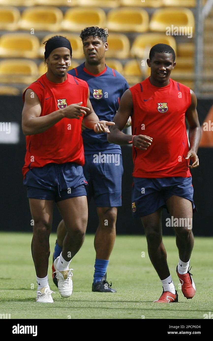 Spain's FC Barcelona soccer player Ronaldinho, left, from Brazil ...