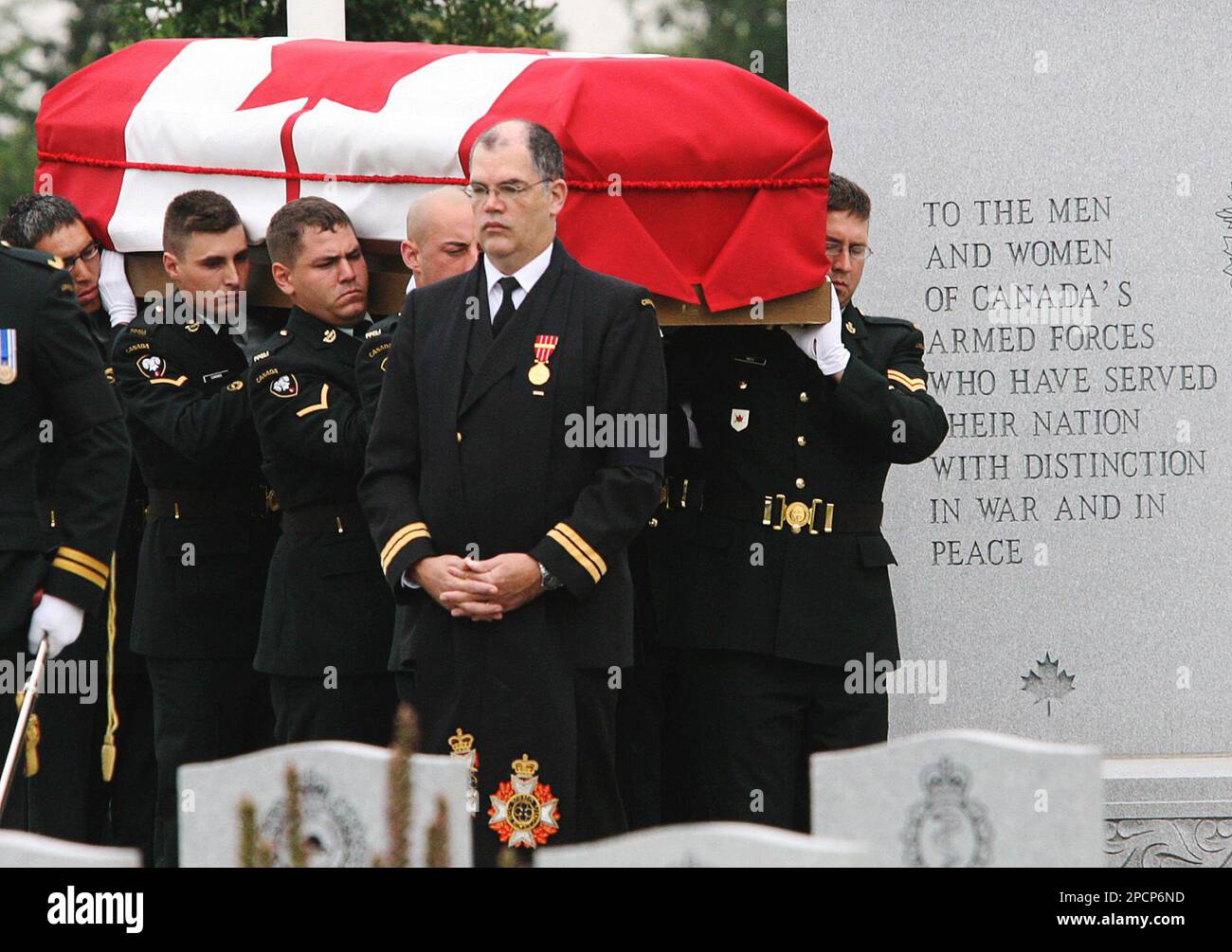 The flag-draped casket of Cpl. Francisco Gomez arrives at the military ...