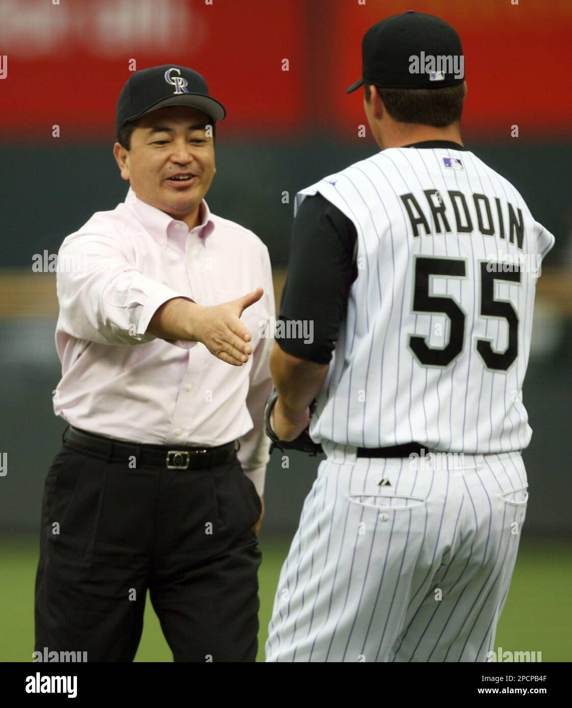 Hiroshi Saito, governor of Yamagata, Japan, shakes hands with Colorado ...