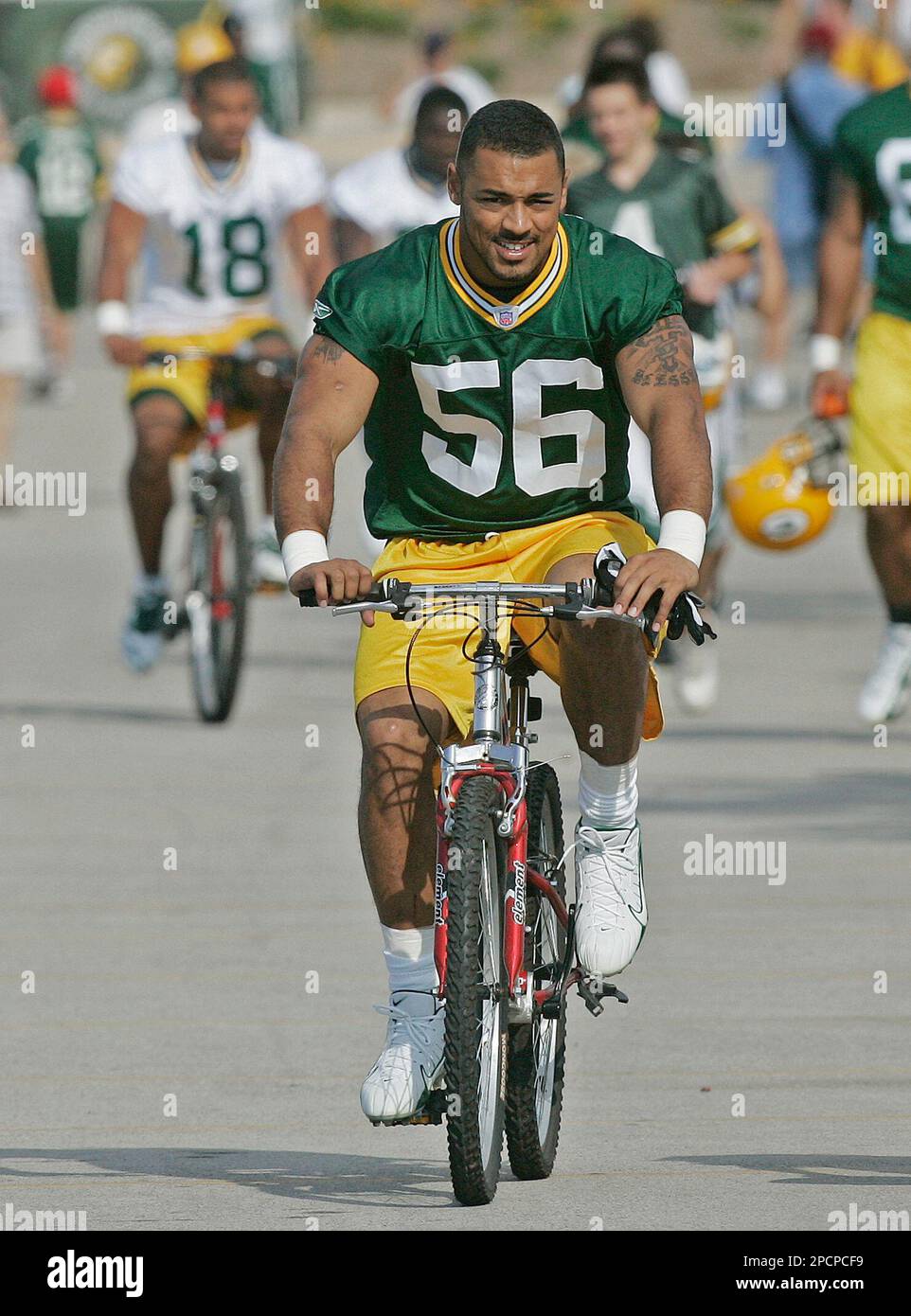 Green Bay Packers linebacker Nick Barnett (56) rides a bike to football ...