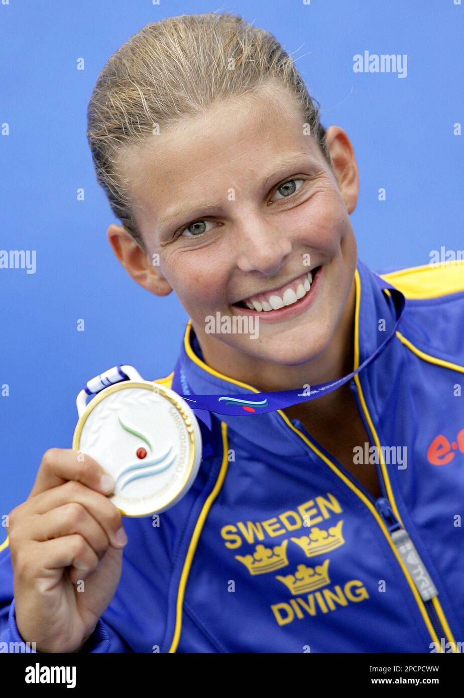 First placed Anna Lindberg, from Sweden poses with her gold medal after ...