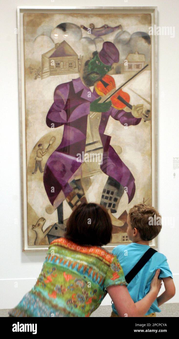 ** FILE ** Visitors look at Marc Chagall's "Green Violinist" in the ...