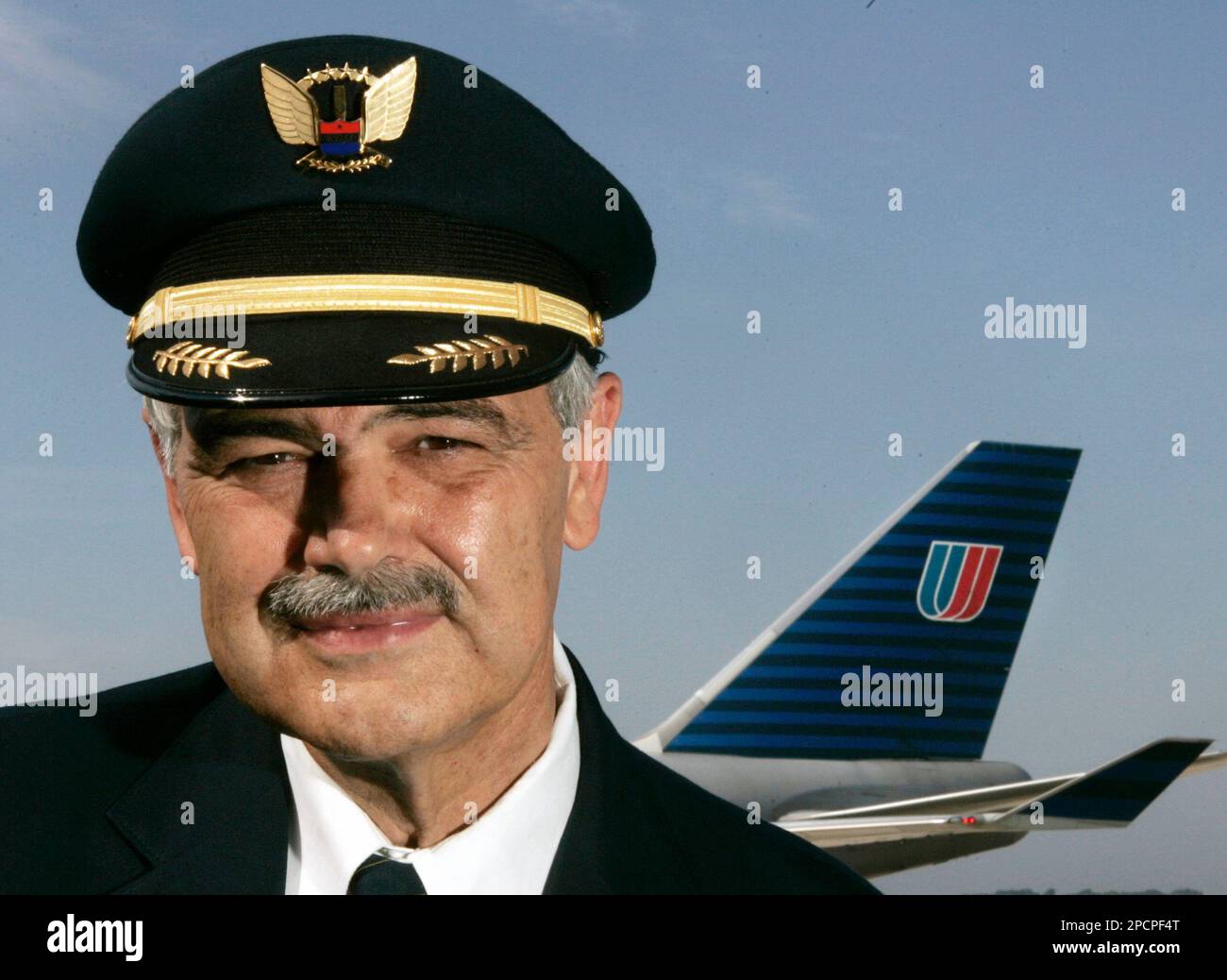 United Airlines pilot Capt. Allan Engelhardt poses at Chicago's O'Hare ...