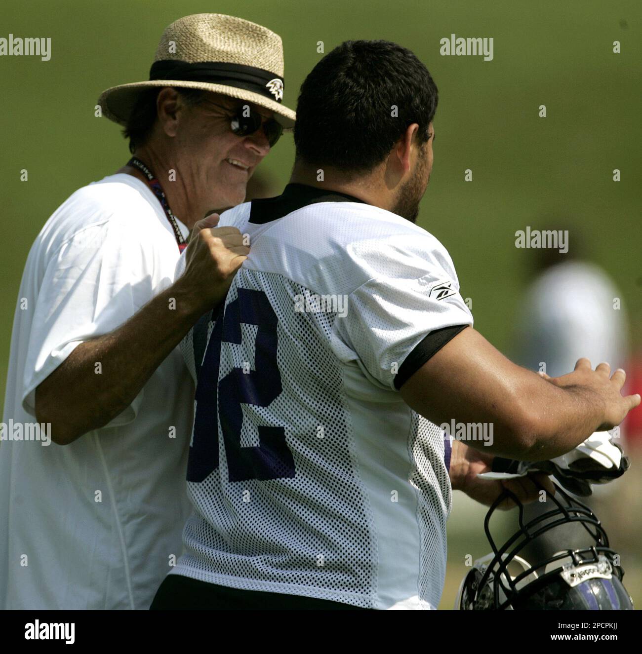Baltimore Ravens first round draft choice Haloti Ngata, right, gets a ...