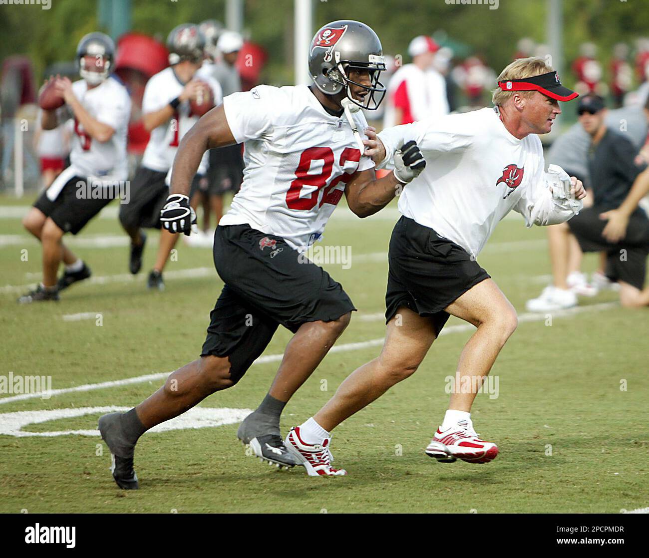 Tampa Bay Buccaneers coach Jon Gruden, right, defends receiver Paris ...