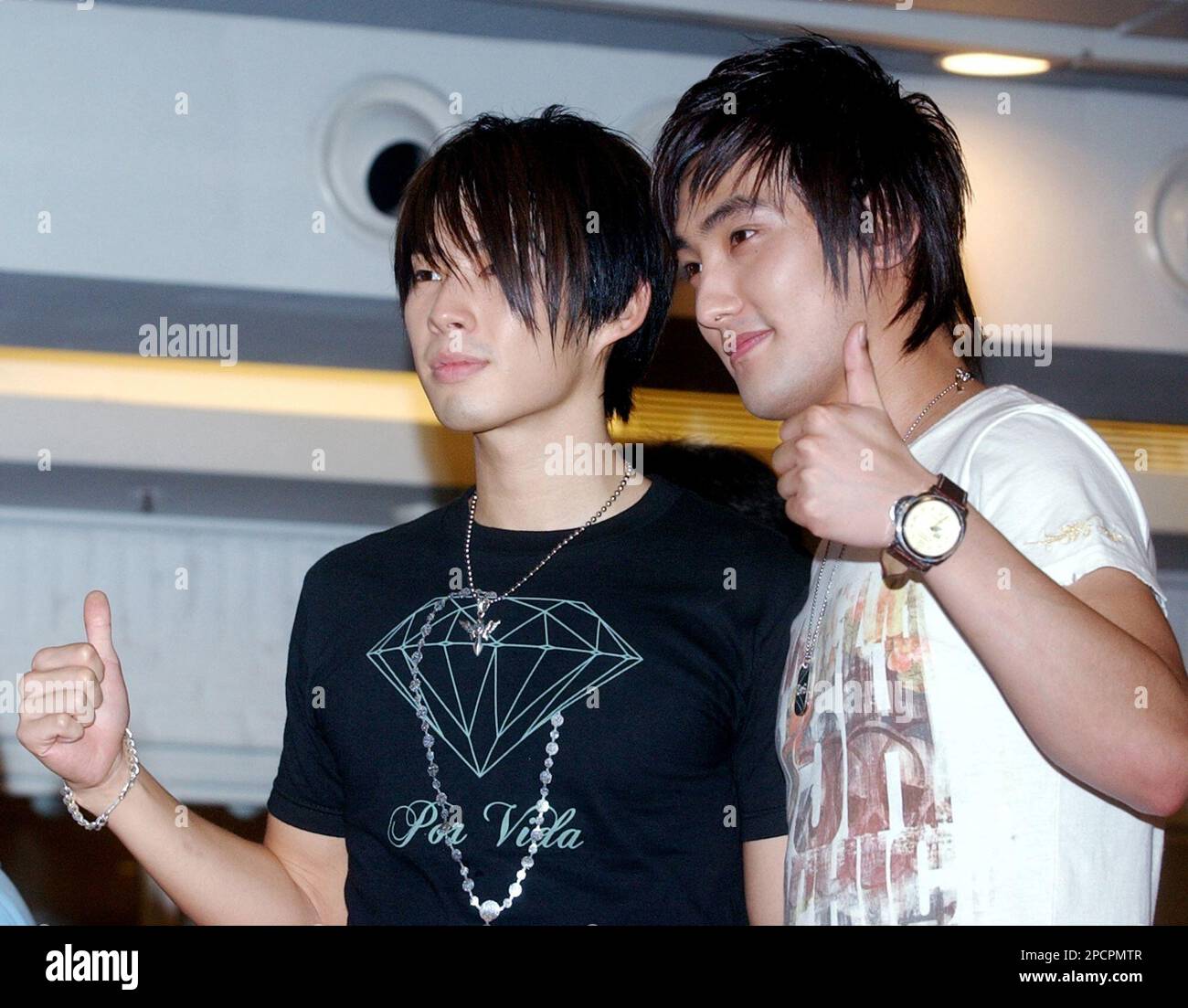 Taiwanese singer Vanness Wu, left, and South Korean singer Kangta pose ...