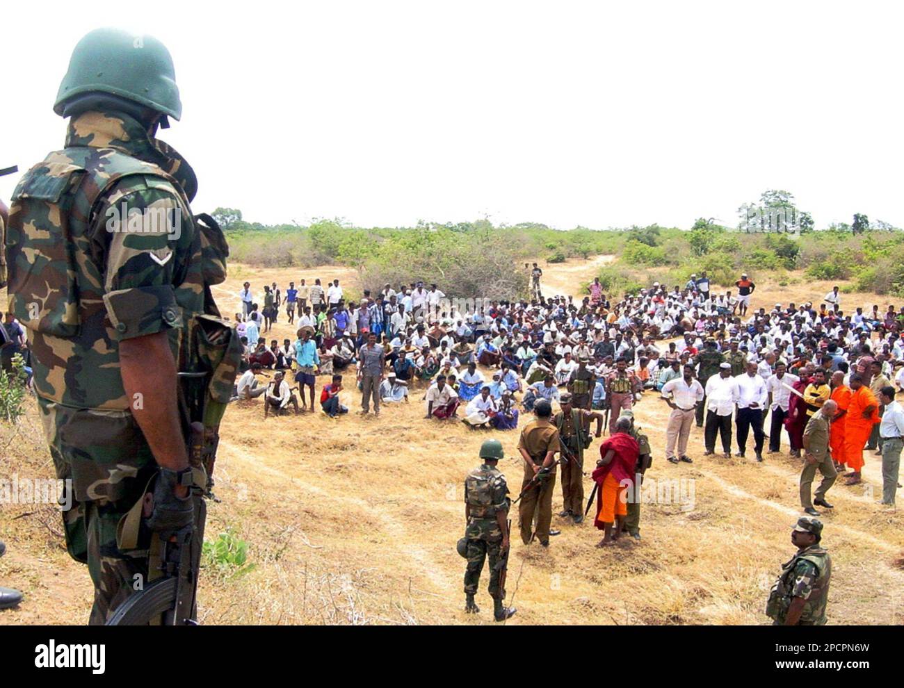 Sri Lankan soldiers stop Buddhist monks and local villagers from ...