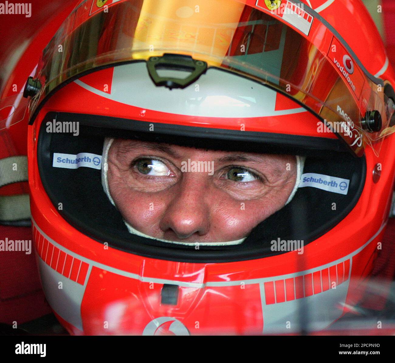 German racer Michael Schumacher sits in his car in the box during a ...