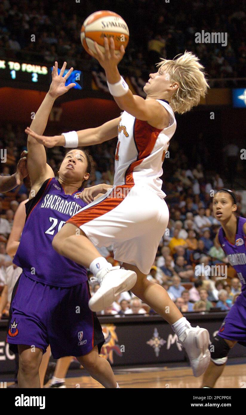 Connecticut Sun's Erin Phillips is fouled by Sacramento Monarchs' Kara ...