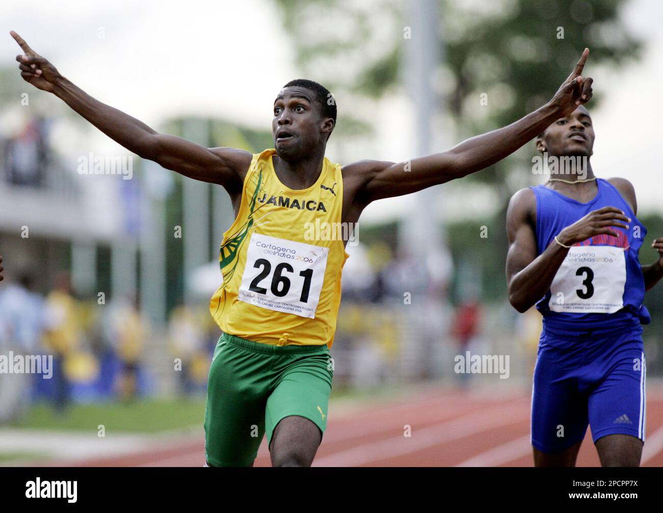 Jamaica's Xavier Brown, left, celebrates after winning the gold medal ...