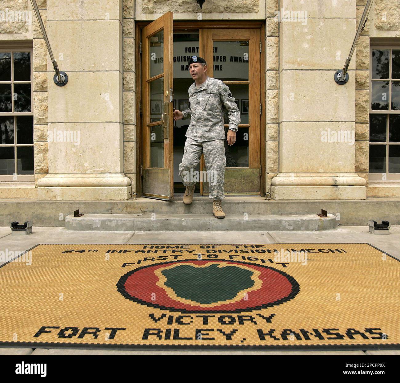 Maj. Gen. Dennis Hardy exits the headquarters building at Fort Riley ...