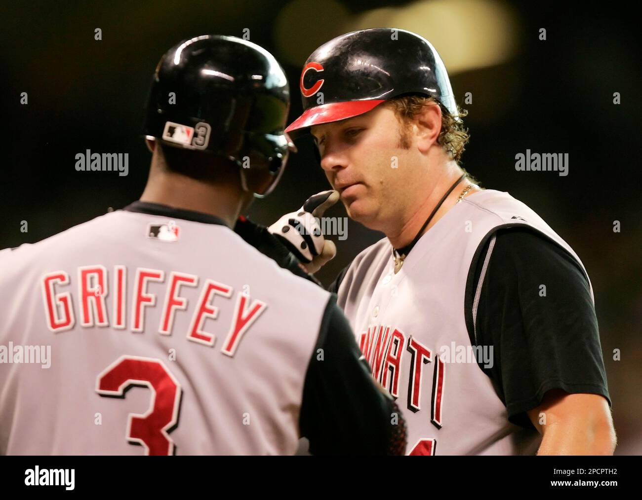 Cincinnati Reds' Adam Dunn, right, celebrates with teammate Ken Griffey ...
