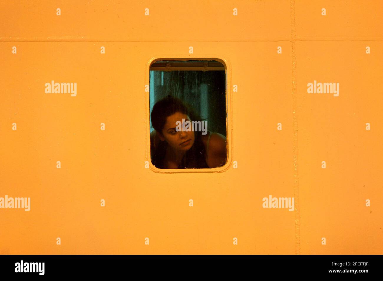 An evacuee woman looks out from the window of the Cypriot "Princesa ...