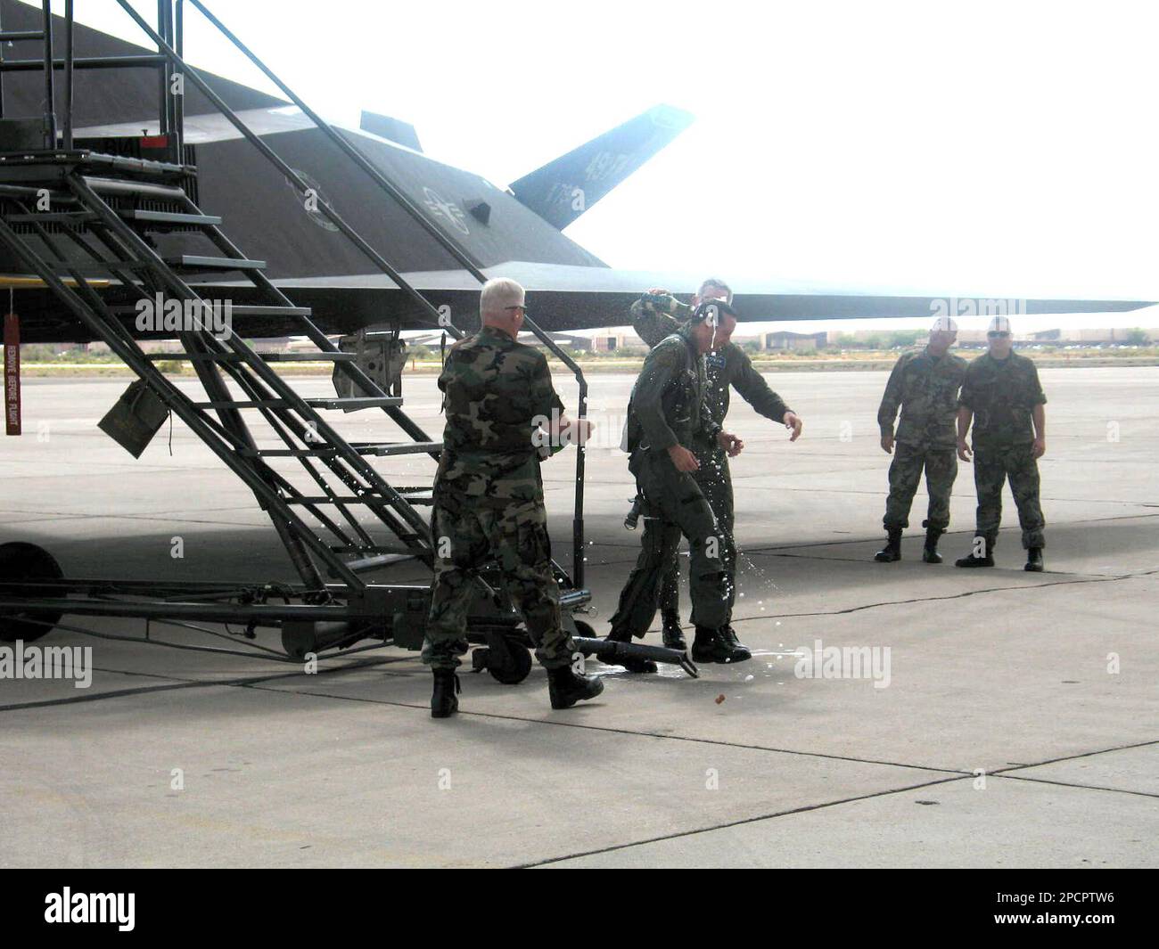 Col. Gary "Buzzard" Bryson, left, and Col. David Moore, with bottle ...