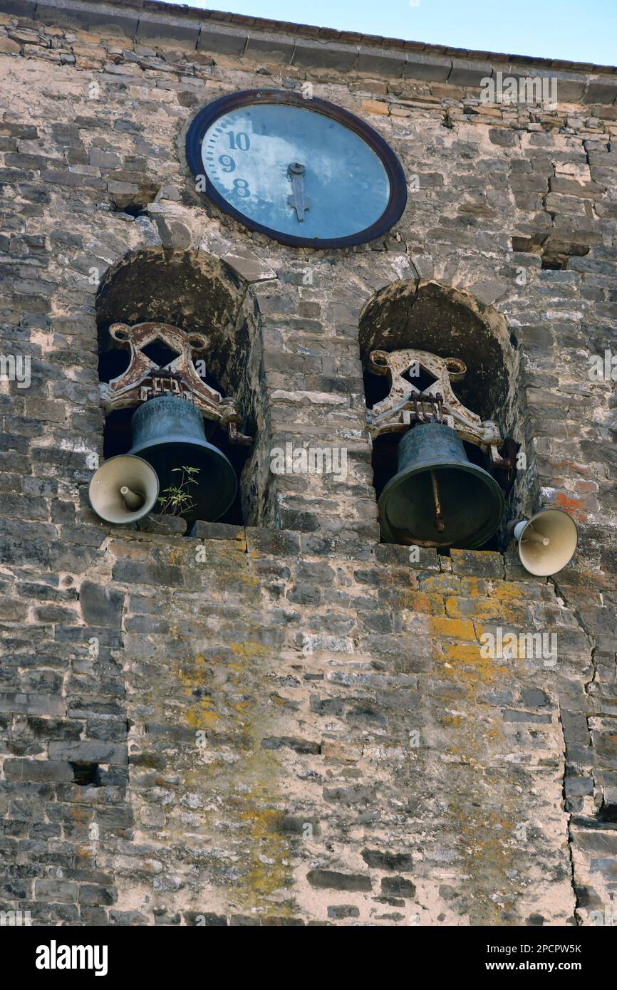 Detail of an old bell tower in a church, with two bells and a rusty ...