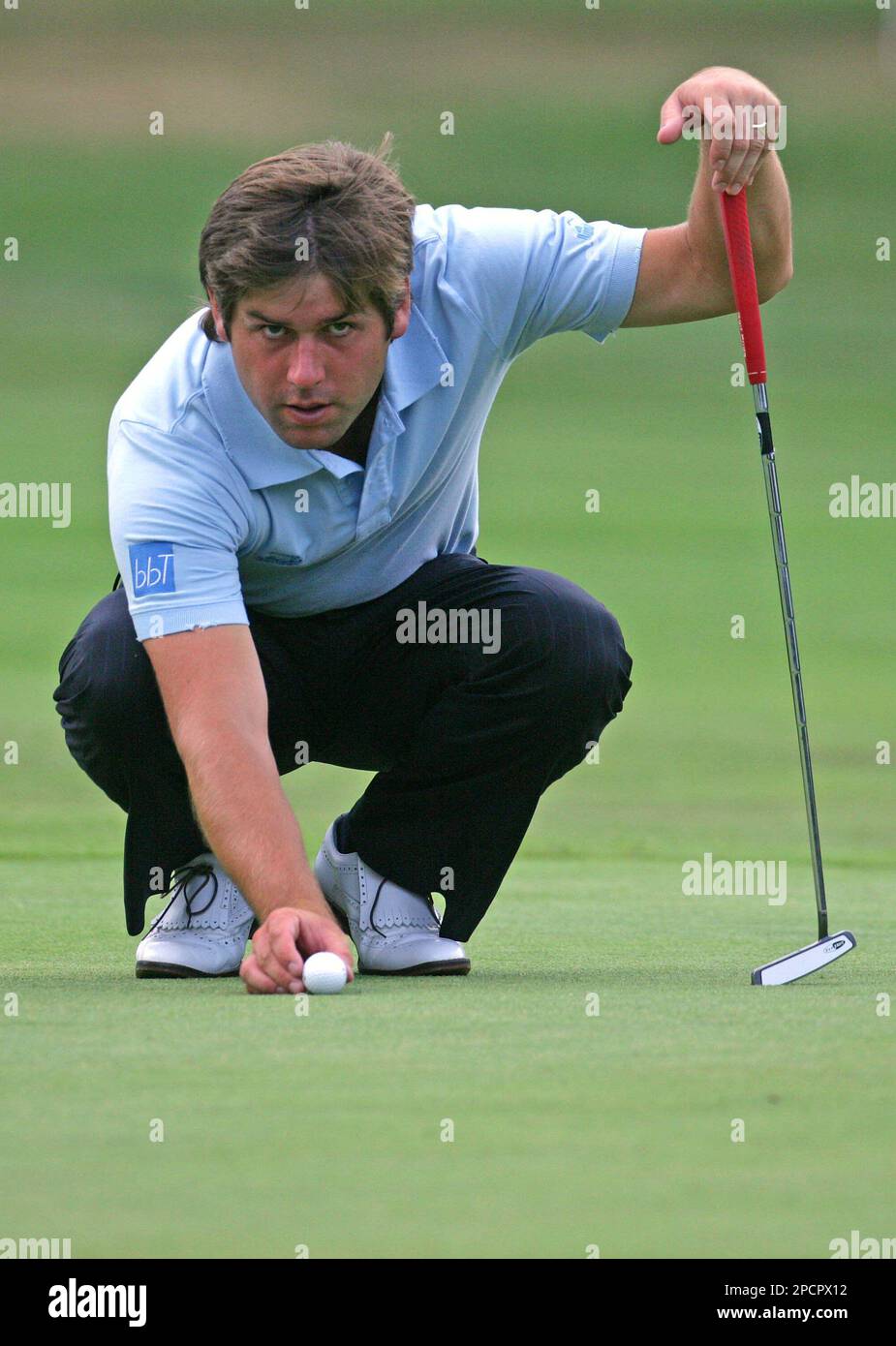 Robert Rock of England lines up a putt on the 10th green during the ...