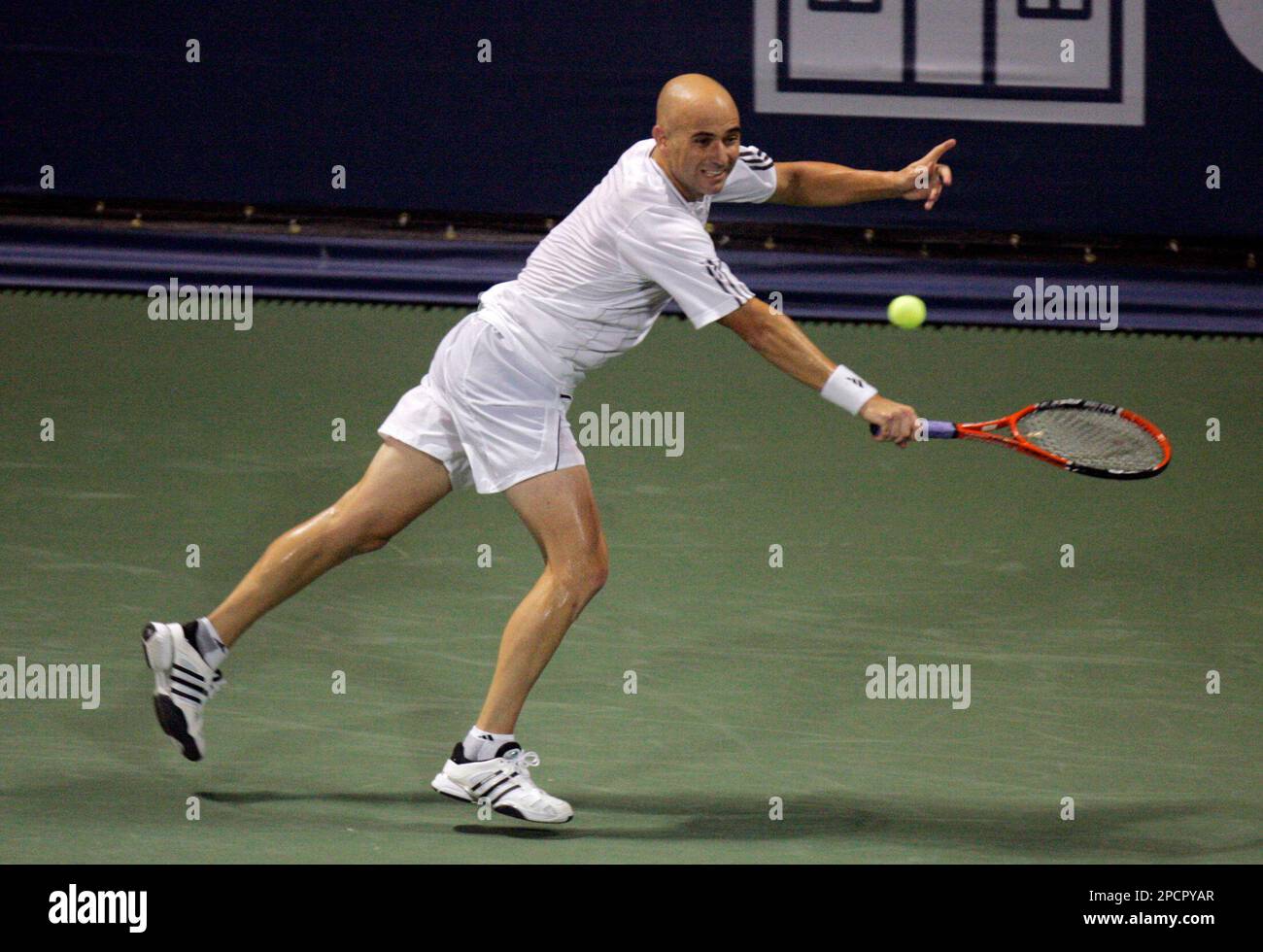 Andre Agassi ireturns to George Bast of Switzerlandl at the Countrywide ...