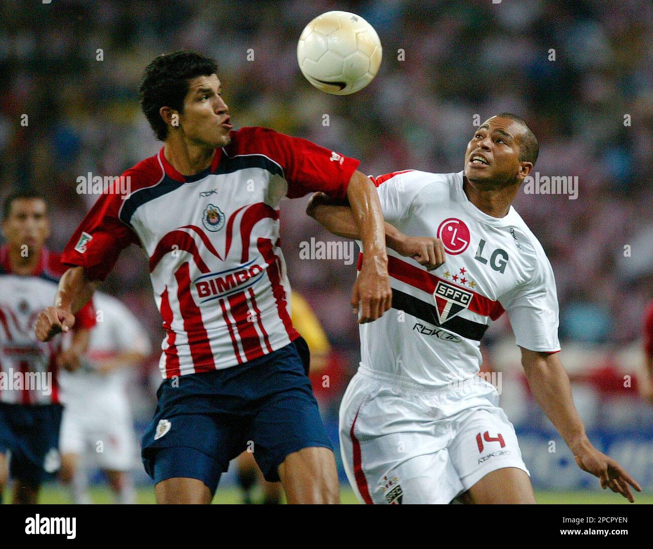 Brazil s Sao Paulo soccer team player Jose Da Silva Aloisi right fights for the ball against Mexico s Chivas Javier Rodriguez during the first leg of their Copa Libertadores semifinal match at the
