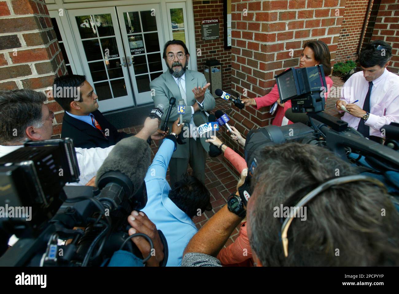 Chris Collins, defense attorney for Benjamin Fawley, talks with the ...