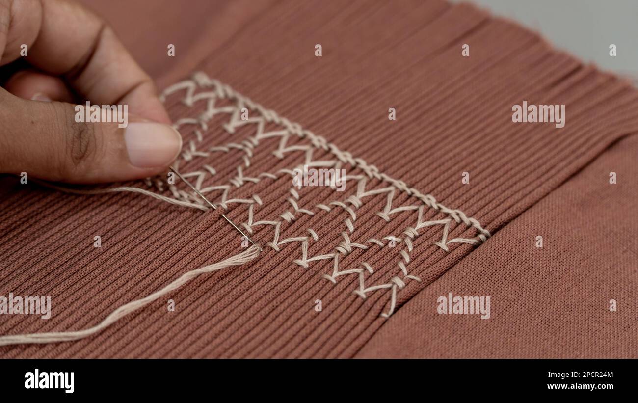 Smocking hi-res stock photography and images - Alamy