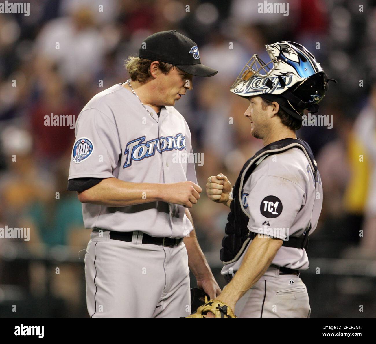 Toronto BlueJays closing pitcher B.J. Ryan, left, is congratulated by ...
