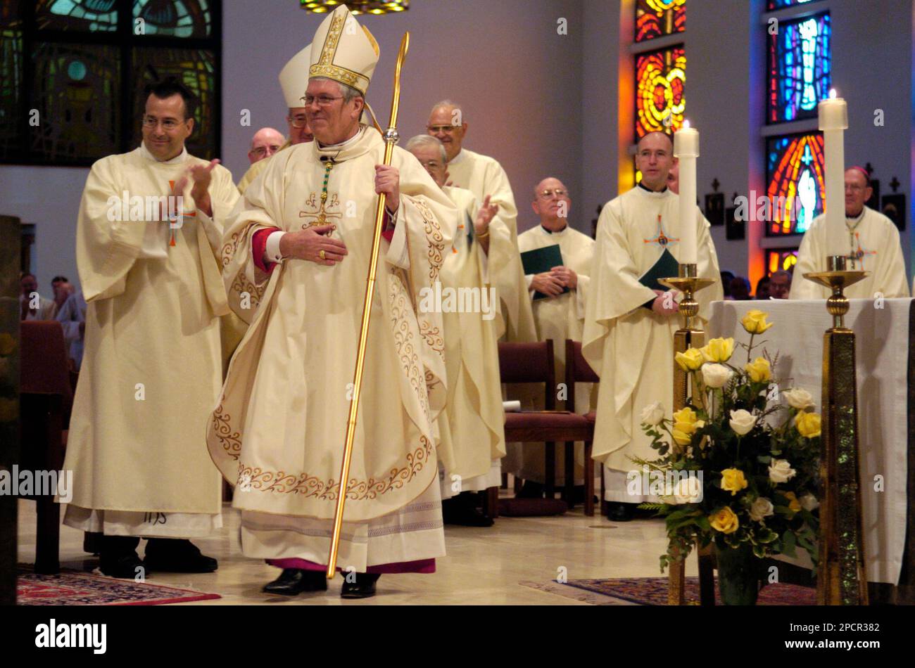 Coadjutor Bishop Frank J. Dewane prepares to greet the crowd during the ...