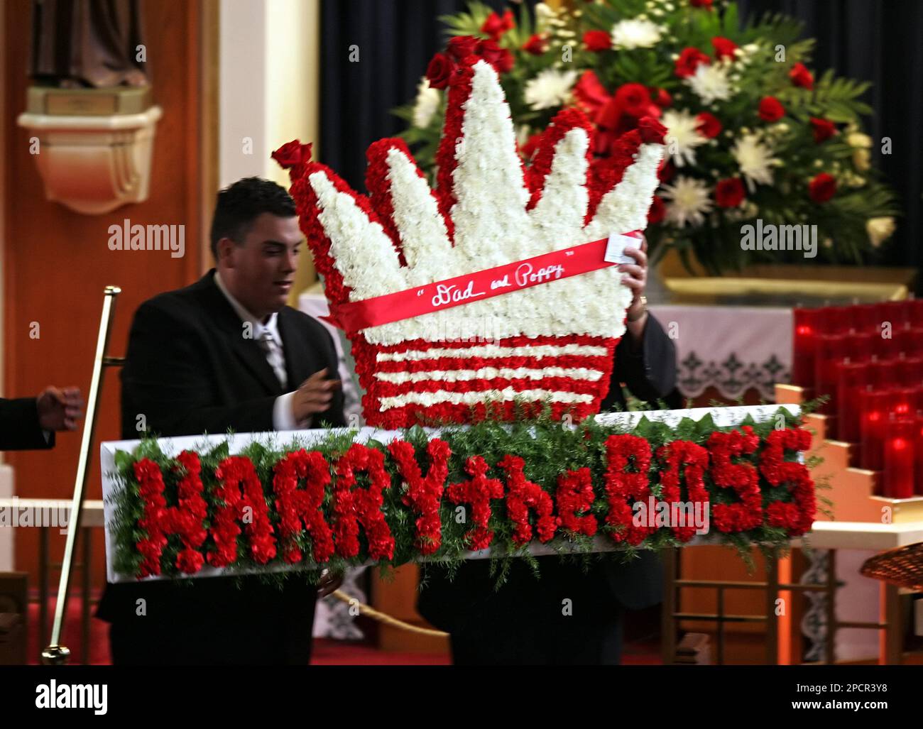 An arrangement reading "Harry the Boss" is seen at the funeral of Harry ...