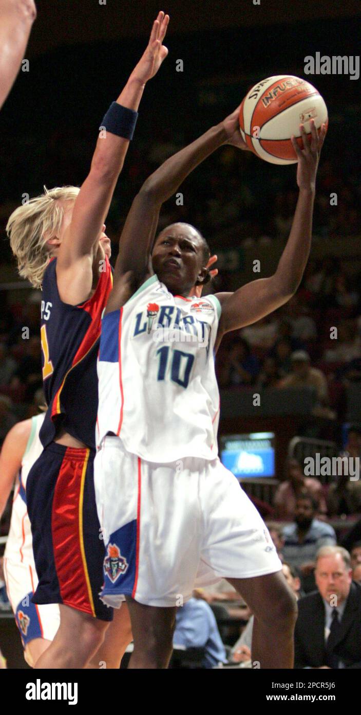 Connecticut Sun's Erin Phillips tries to block the New York Liberty's ...