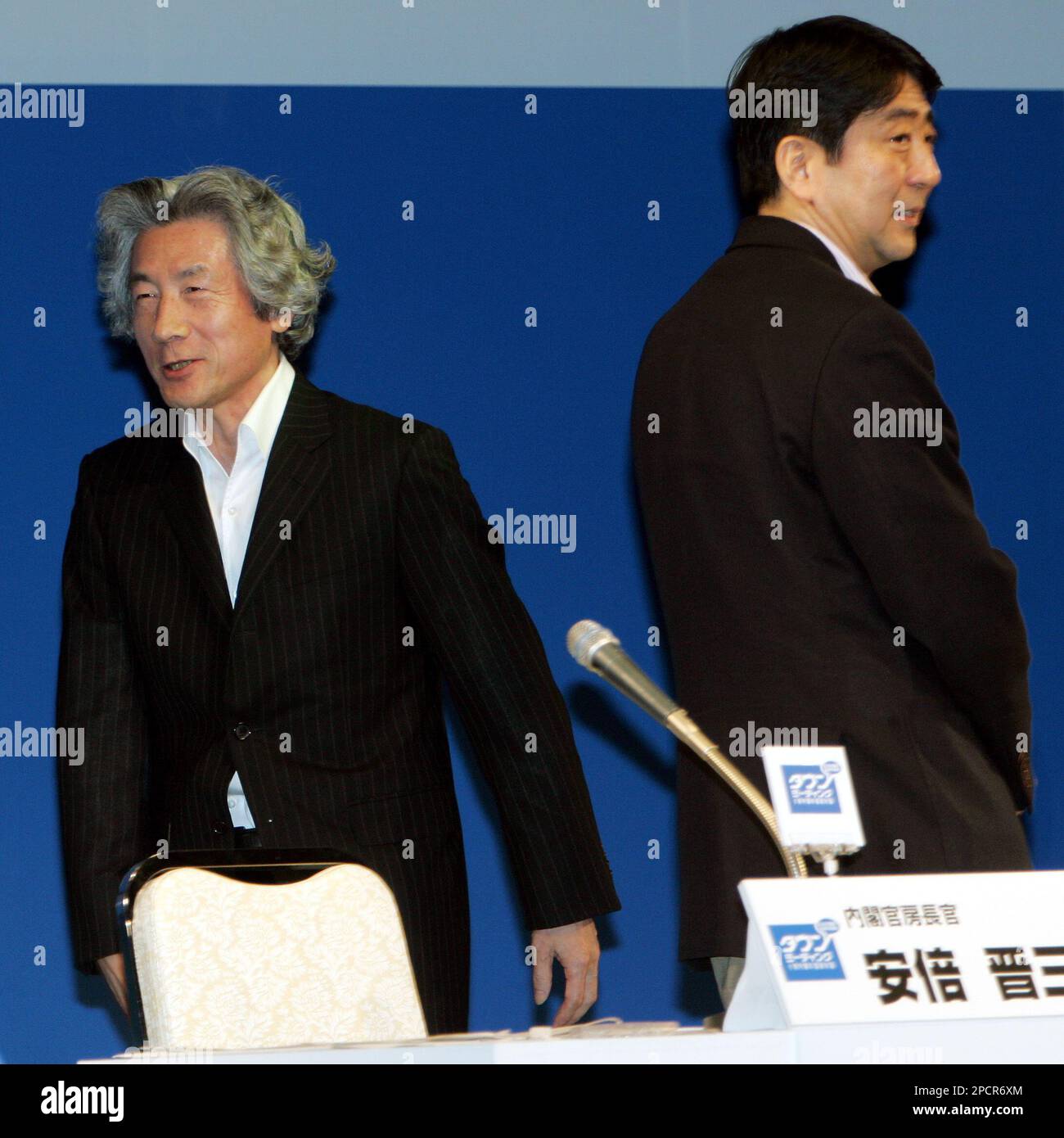 Japanese Prime Minister Junichiro Koizumi, left, and Chief Cabinet Secretary Shintaro Abe, leave ...