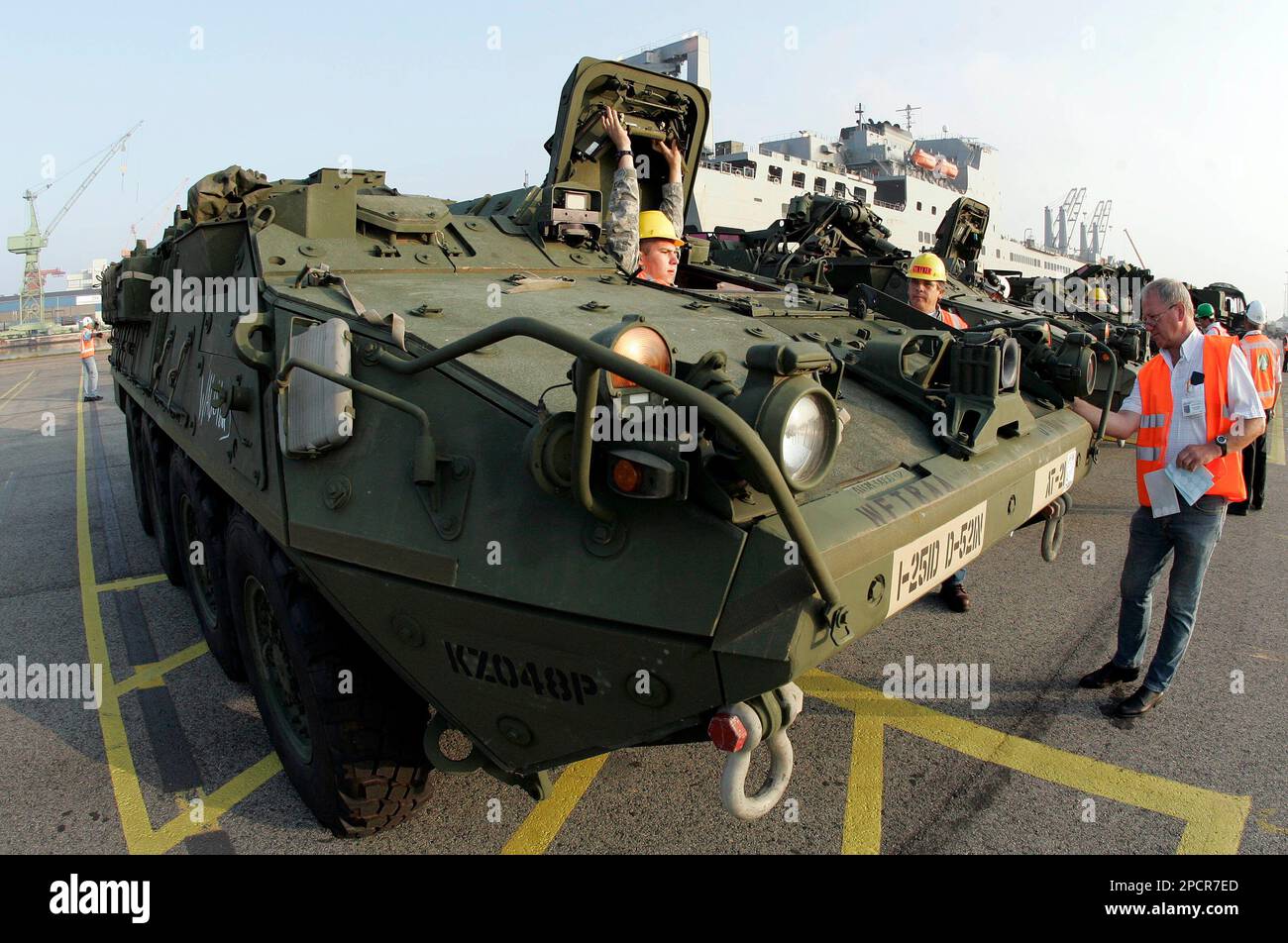 The first 120 of a total of 309 "Strykers" roll off the U.S. Navy cargo ...