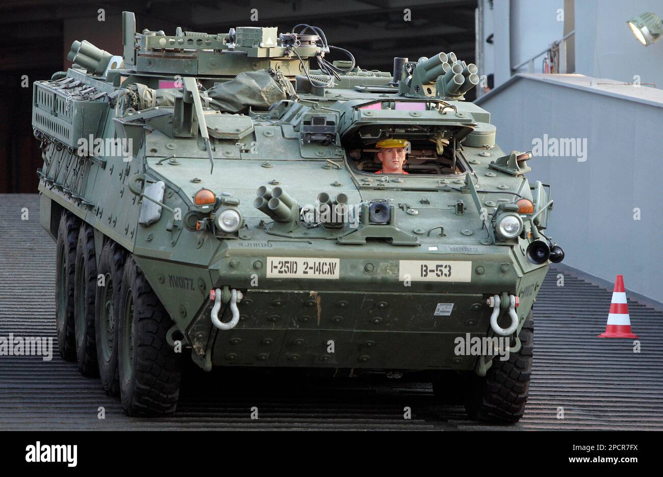 The first 120 of a total of 309 "Strykers" roll off the U.S. Navy cargo ...