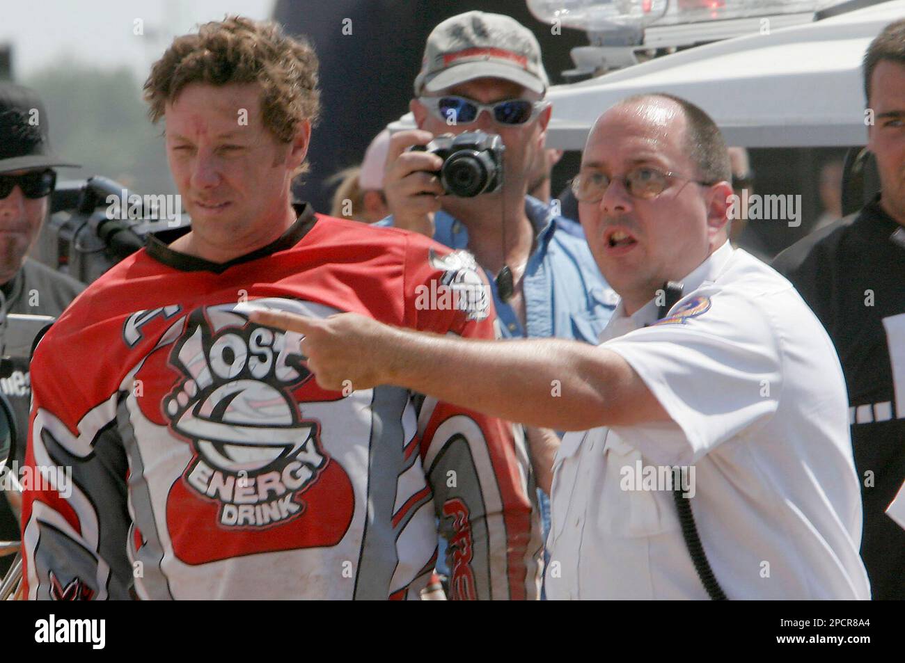 Motorcycle daredevil Trigger Gumm is helped to an ambulance by ...