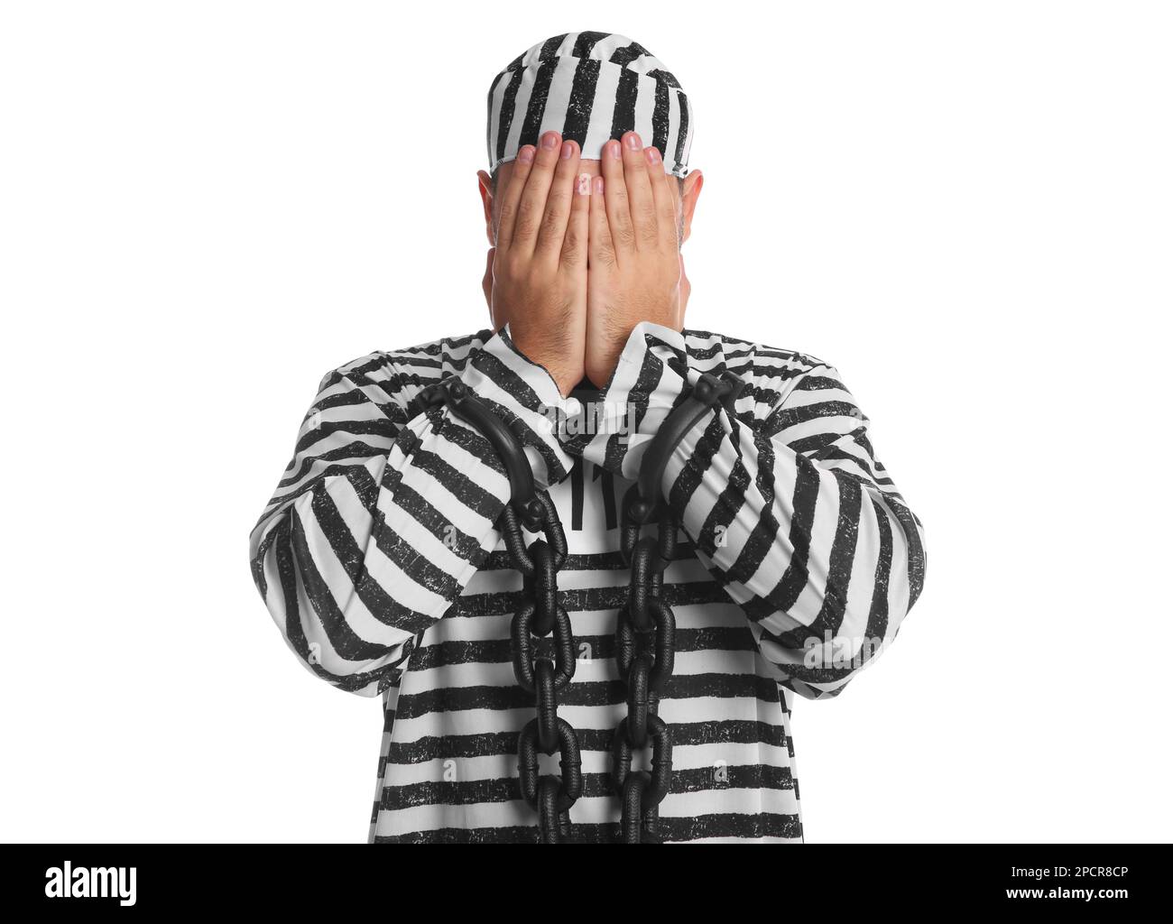 Prisoner in special uniform with chained hands on white background ...