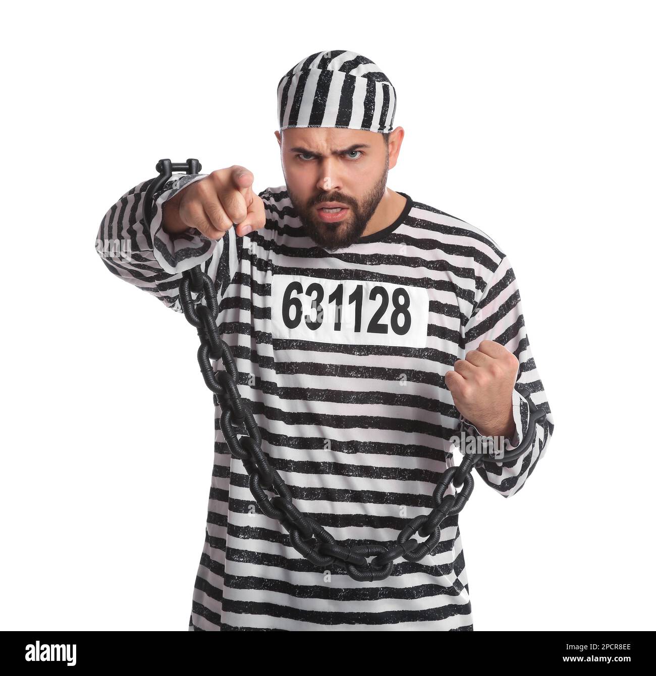 Angry prisoner in special uniform with chained hands on white ...