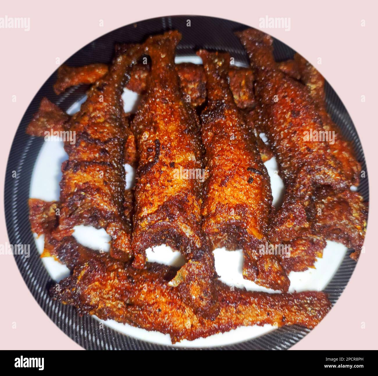 roasted fish with vegetables. roasted fish wings. roasted fish on a ...