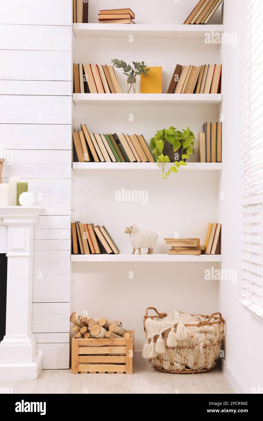 Collection of books and decor elements on shelves indoors. Interior ...