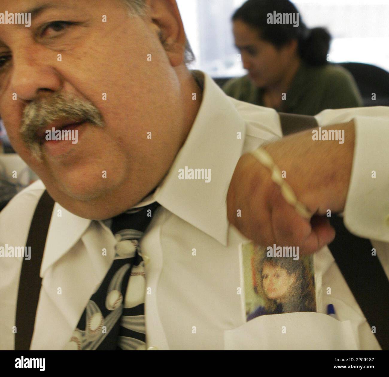Richard Pecorella reaches for a prayer card photo of his fiancee Karen ...