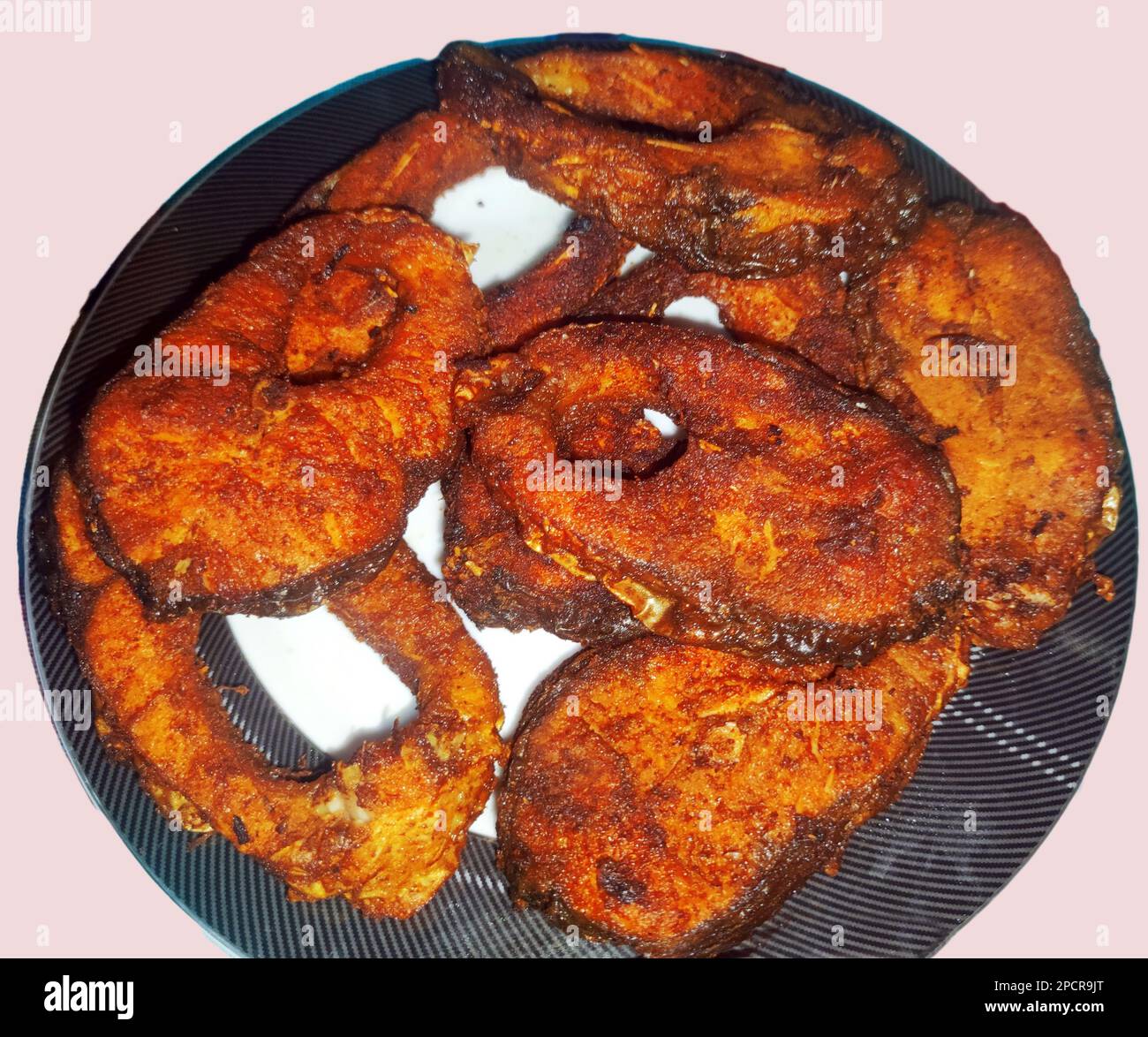 roasted fish with vegetables. roasted fish wings. roasted fish on a ...