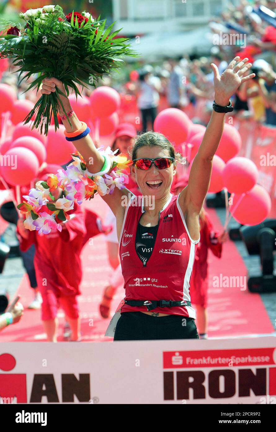 Germany's Andrea Brede crosses the finish line to win Ironman Triathlon ...