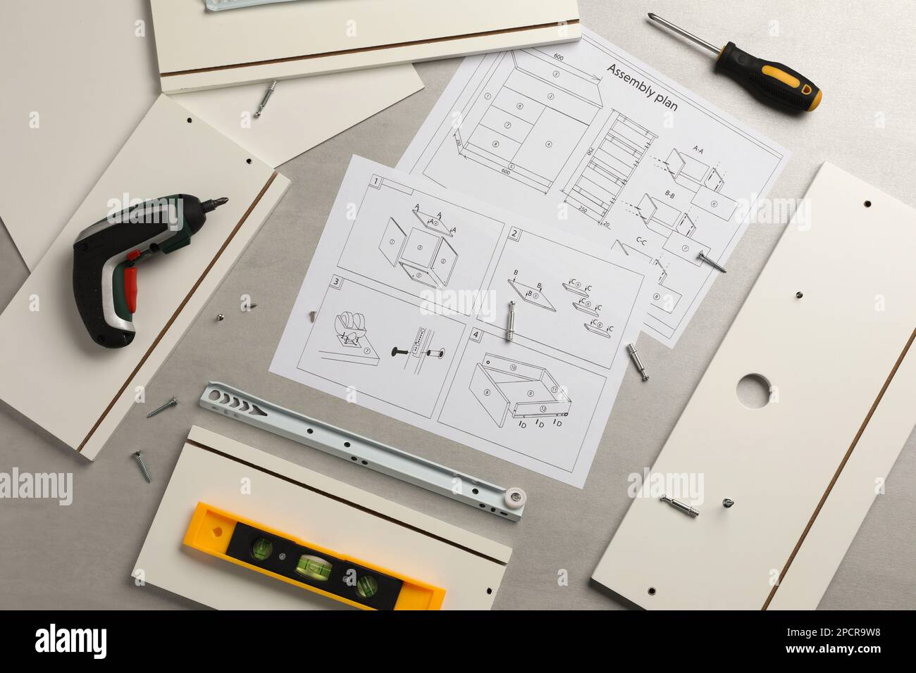 Flat lay composition with furniture parts and tools for self-assembly ...