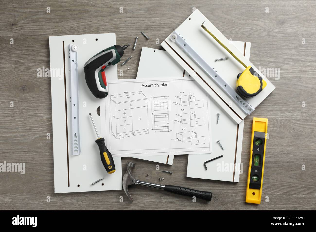 Flat lay composition with furniture parts and tools for self-assembly ...